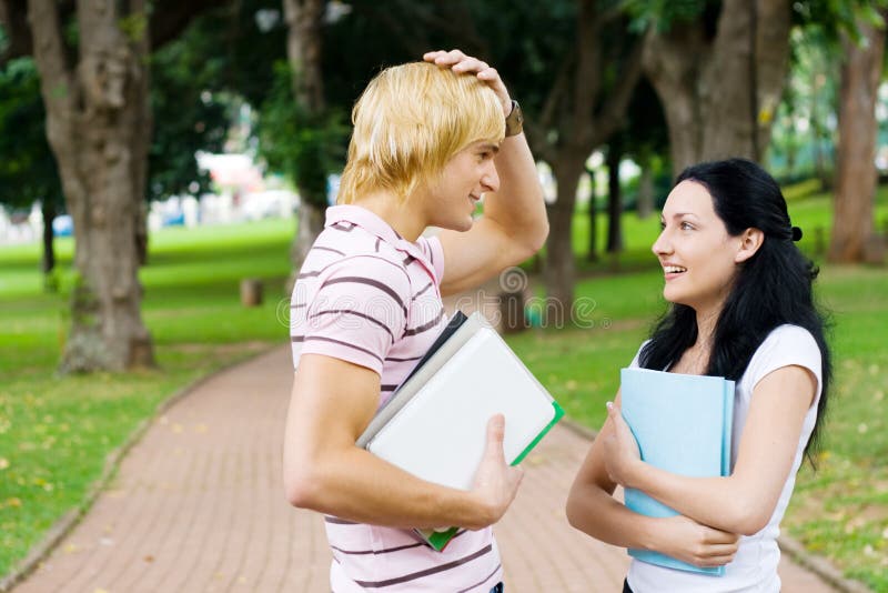 Two Students Talking on Campus Stock Image - Image of class, couple ...