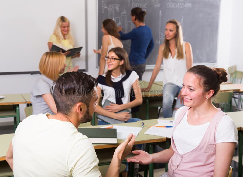 Students Chatting while Sitting in the Room Stock Photo - Image of ...