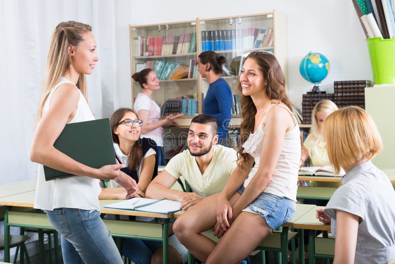 Students Chatting while Sitting in the Room Stock Image - Image of ...