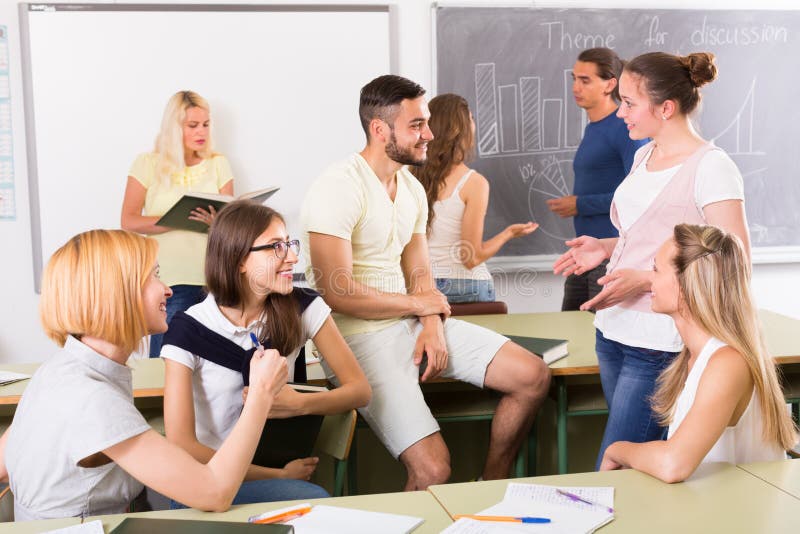 Students Chatting while Sitting in the Room Stock Image - Image of ...