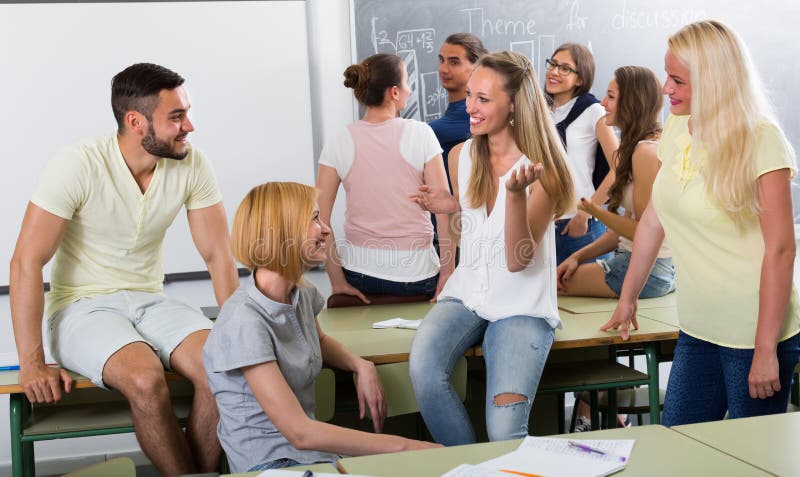 Students Chatting while Sitting in the Room Stock Photo - Image of ...