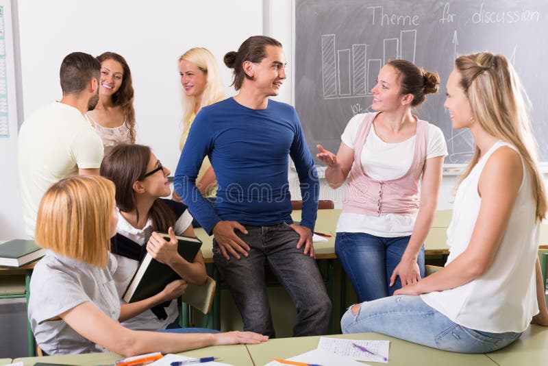 Students Chatting and Smiling at the College Stock Photo - Image of ...