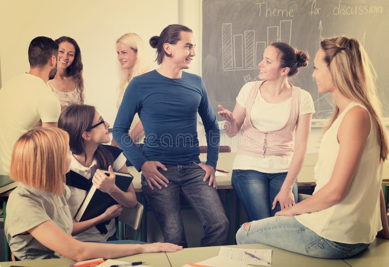 Students Chatting and Smiling at the College Stock Image - Image of ...