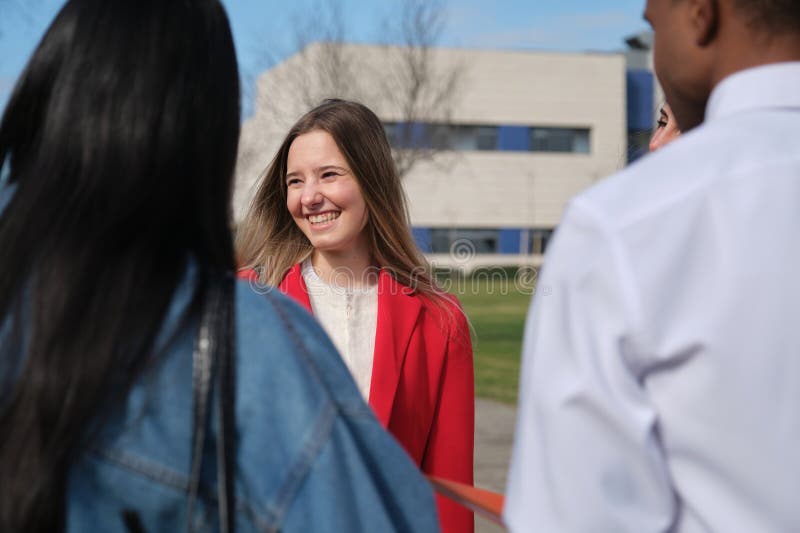 Students Chatting and Smiling Outdoors in University Campus Stock Image ...