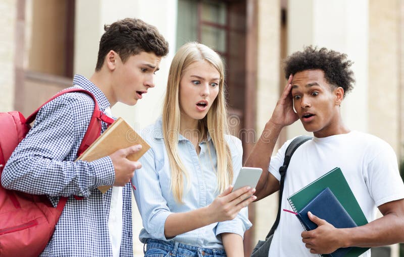 Students Checking Exam Results on Smartphone, Resting in Campus Stock ...