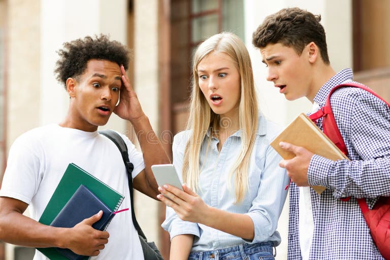 Students Checking Exam Results on Smartphone, Resting in Campus Stock ...