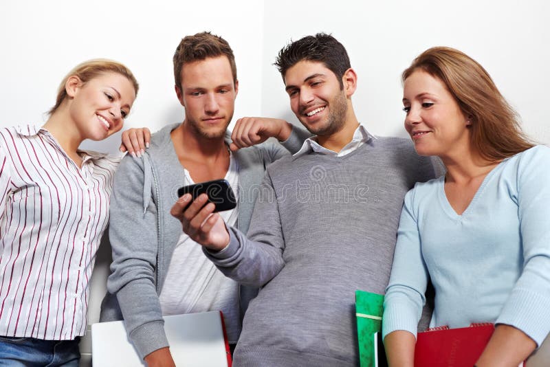 Multiethnic Group of Four Men Using Smartphone, Laptop Computer ...