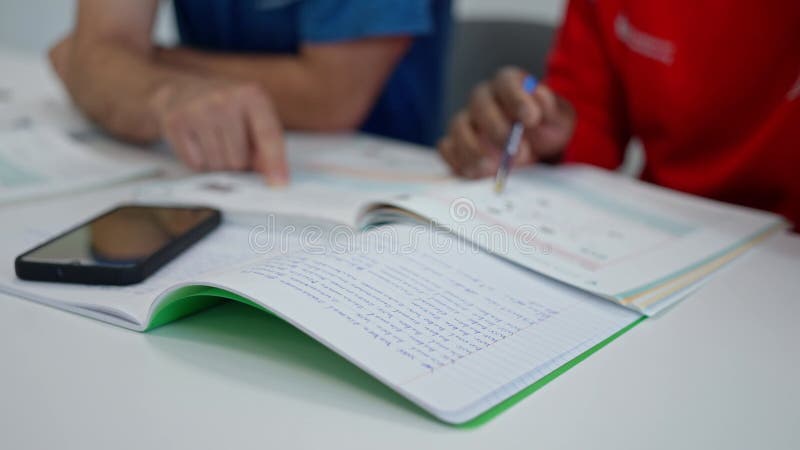 Students in a Classroom are Focused on Studying with Books and a ...