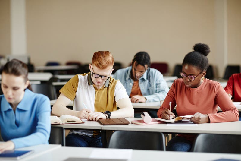 Students in Classroom stock image. Image of writing - 246997095