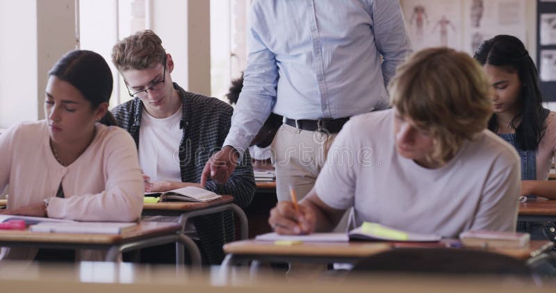 Students in a Classroom Writing, Learning and Reading Off a Chalkboard ...
