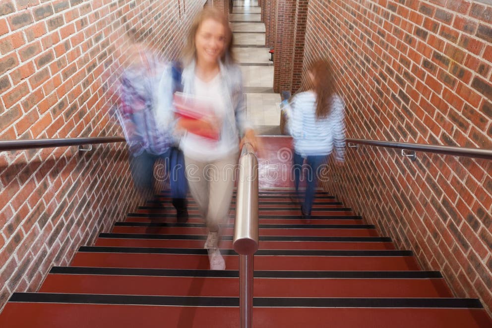 Students climbing stairs stock image. Image of shoulder - 35782947