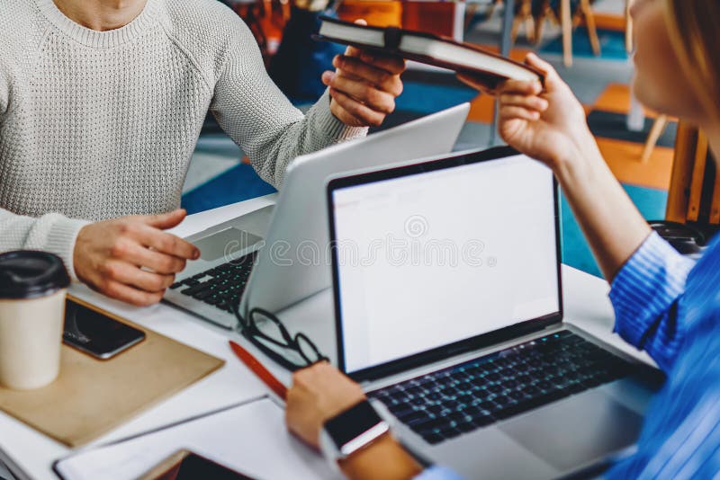 Students Collaborating on Common Task Using Book and Internet Stock ...