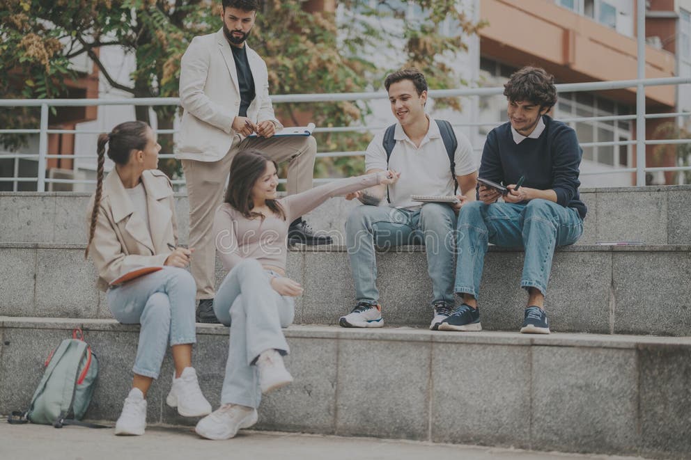 Students Collaborating Outdoors with Guidance from a Supportive ...