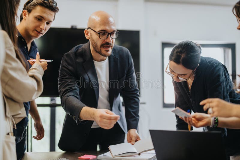 Students Collaborating with Professor on Academic Project for Guidance ...