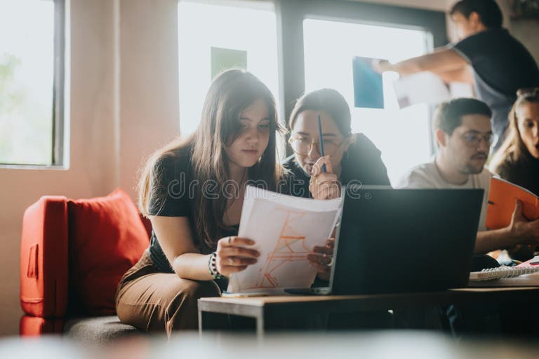 Students Collaborating on School Assignments with Technology and ...