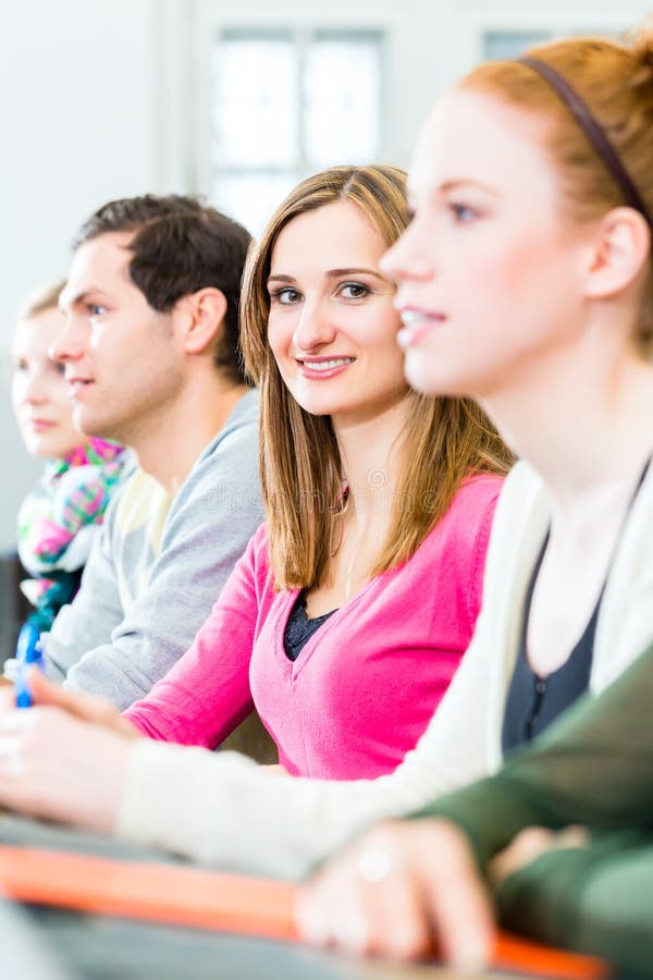 Students in College Learning Stock Photo - Image of notes, listening ...