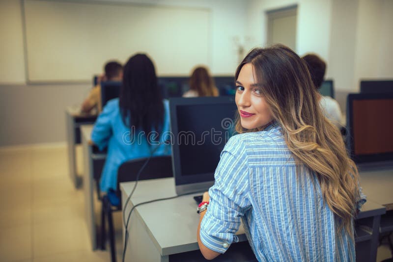 Students in a computer lab stock image. Image of classmates - 227261743