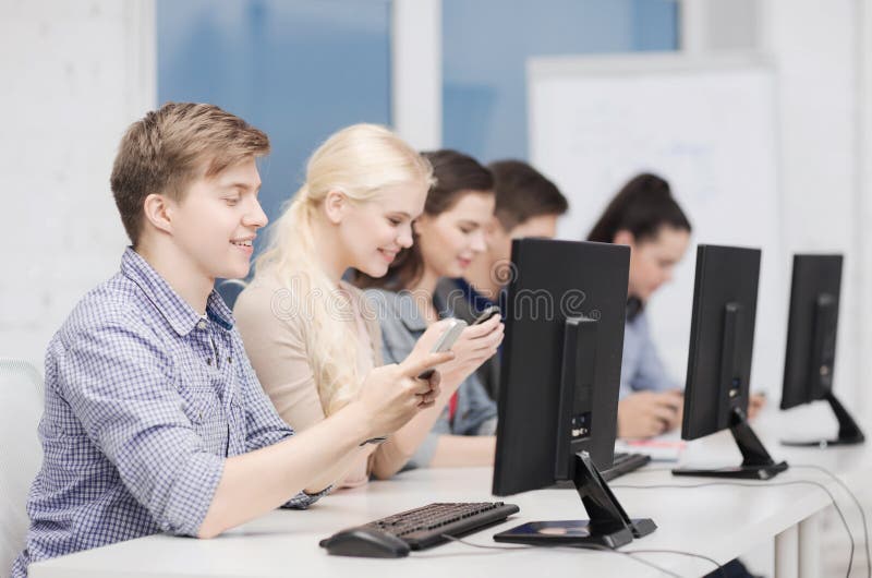 Students with Computer Monitor and Smartphones Stock Image - Image of ...