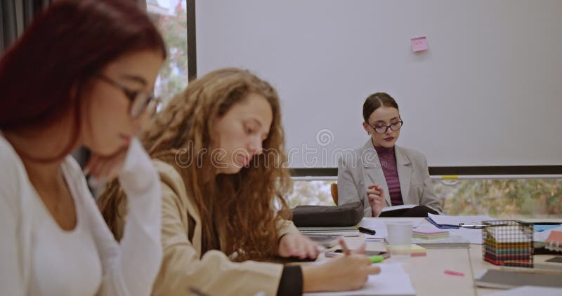 Students Concentrated on Exam with Supervising Professor during Class ...