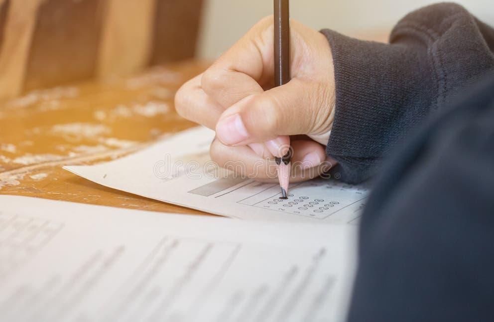 Students Concentration Holding Pencils in Hand Doing Multiple-choice ...