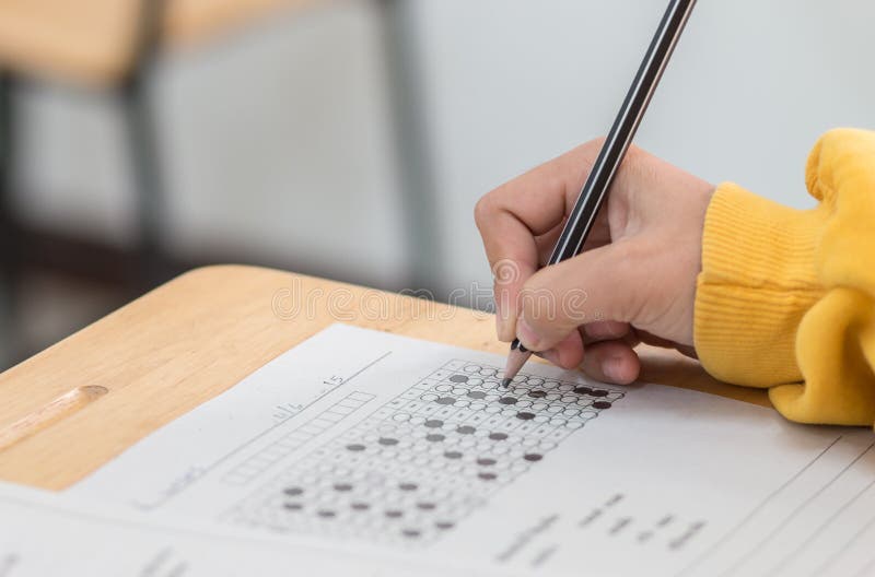 Students Concentration Holding Pencils in Hand Doing Multiple-choice ...