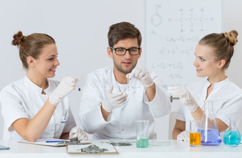 Students Conducting an Experiment Stock Image - Image of protective ...
