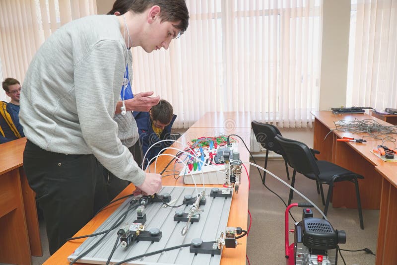 Students Connect Wires Control Panel with Small Test Bench for ...