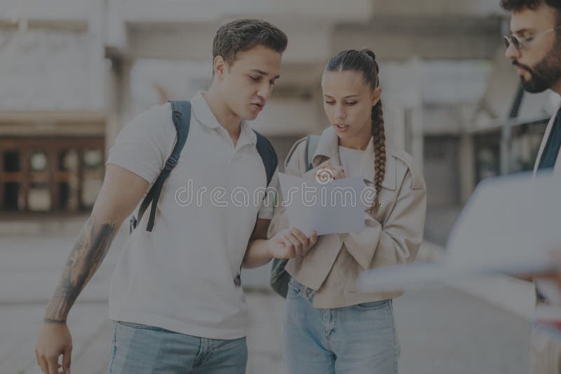 Students Discussing with Professor Outdoors on a University Campus ...