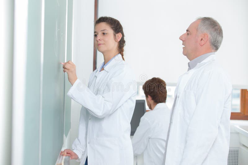 Students Doing Chemistry Experiment in Science Class Stock Image ...
