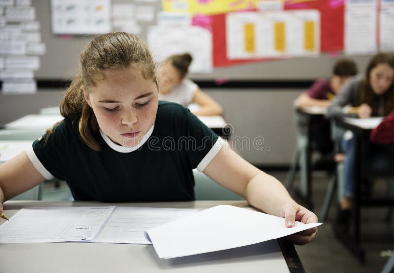 Students Doing Exam in Classroom Stock Photo - Image of paper, exam ...