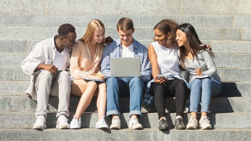 Students Doing Homework on Laptop, Sitting on Stairs in City Stock ...