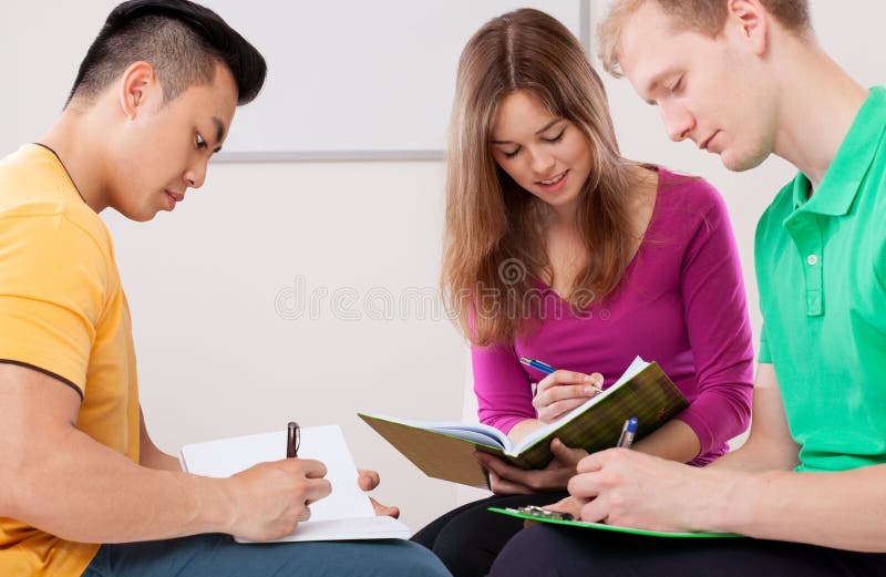 Students doing homework stock photo. Image of friends - 43416068