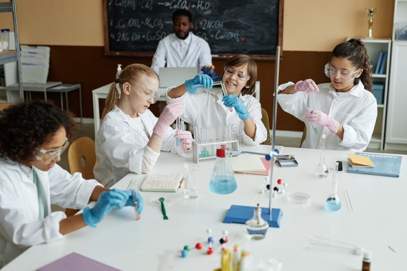 Students Doing Lab Experiments during Lesson Stock Photo - Image of ...