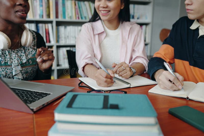 Students Doing Teamwork in the Library Stock Photo - Image of textbook ...