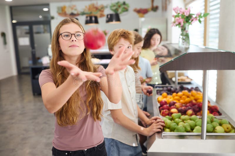 Students Enjoying Fresh Fruit Selection in a Vibrant School Cafeteria ...