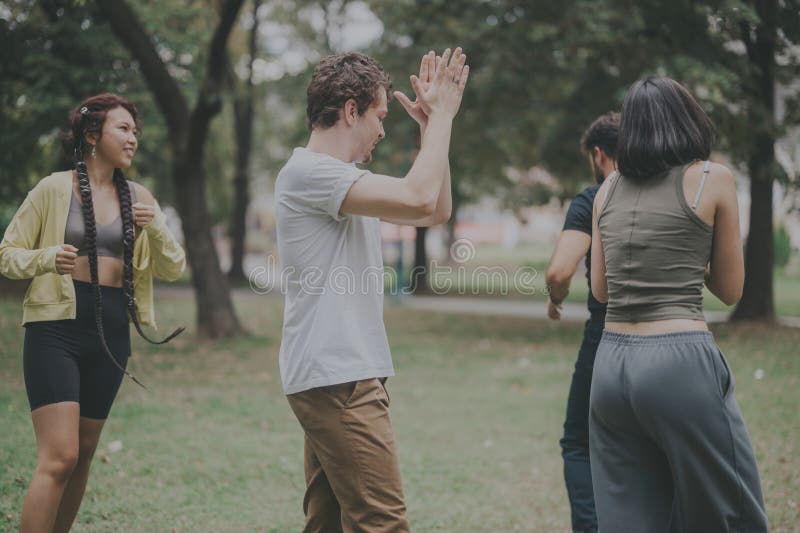 Students Enjoying a Sports Class in the Park with Their Instructor ...