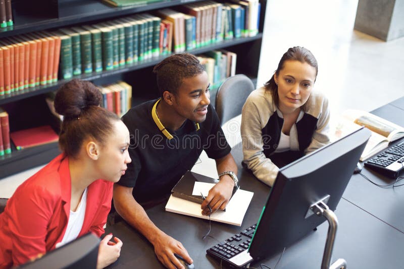 Students Finding Information on Computer for School Project Stock Photo ...