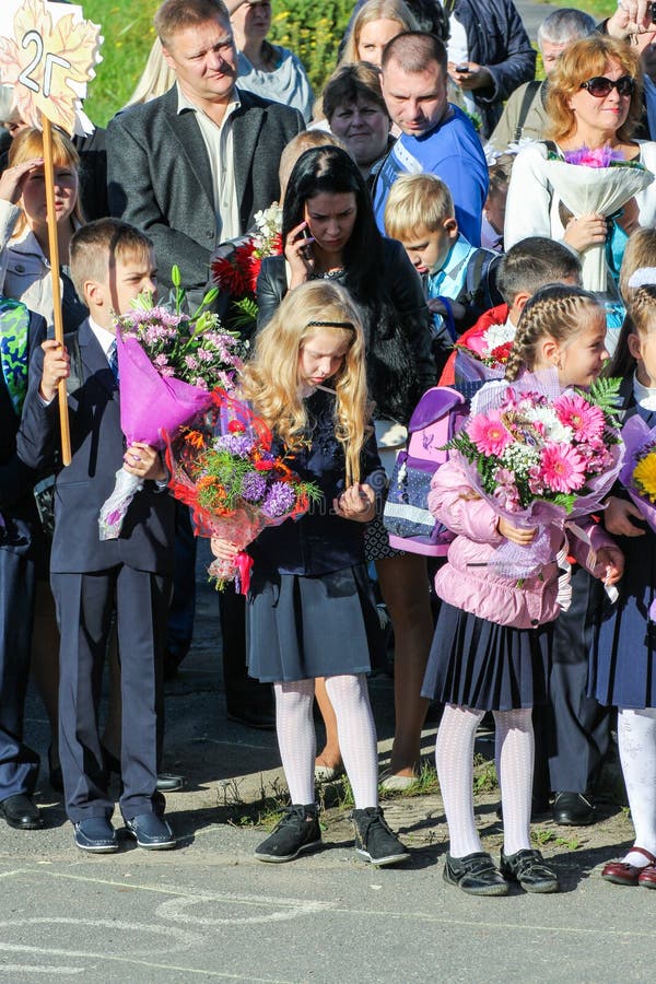 Students with flowers. editorial photo. Image of uniform - 77342066