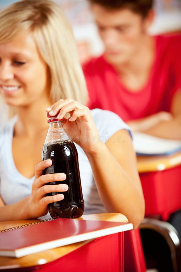 Students: Focus on Soda Bottle on School Desk Stock Photo - Image of ...