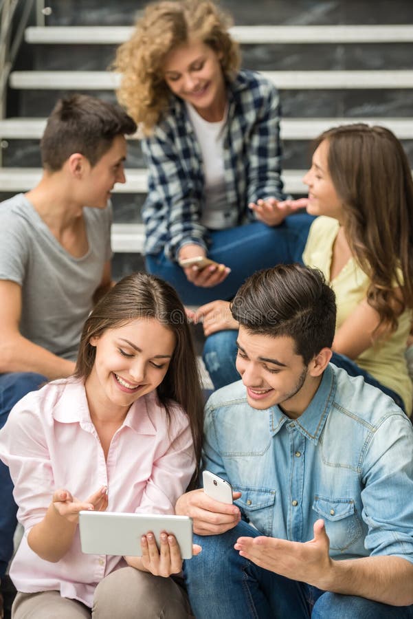 Students with gadgets stock image. Image of phone, friendship - 56342177