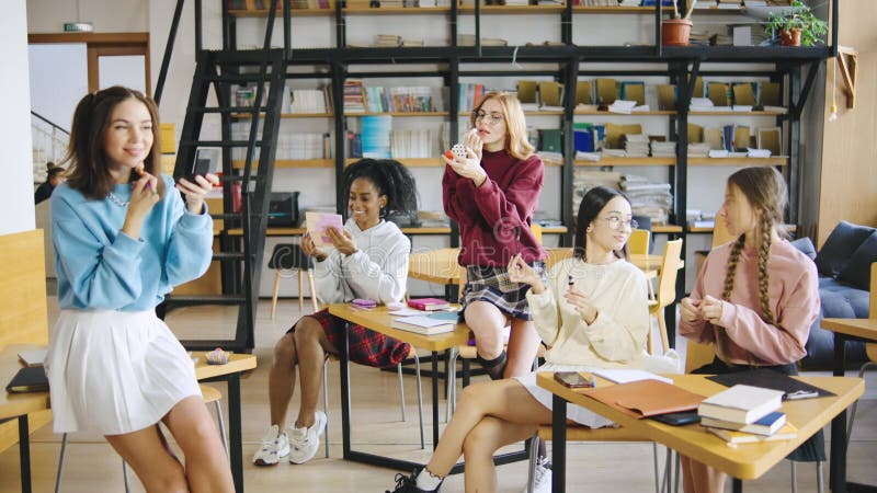 Multiracial Students Enjoy Recess in the University Library and Use ...