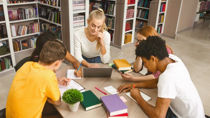 Students Gathering in Circle, Making Homework Together Stock Photo ...