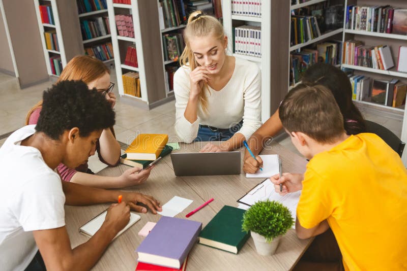 Students Gathering in Circle, Making Homework Together Stock Image ...