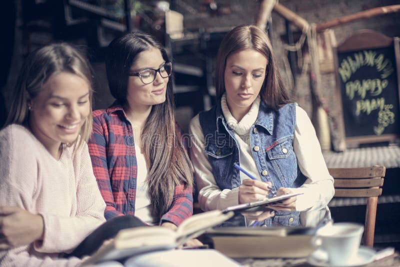 Students Girls Learning Together. Stock Image - Image of looking, book ...