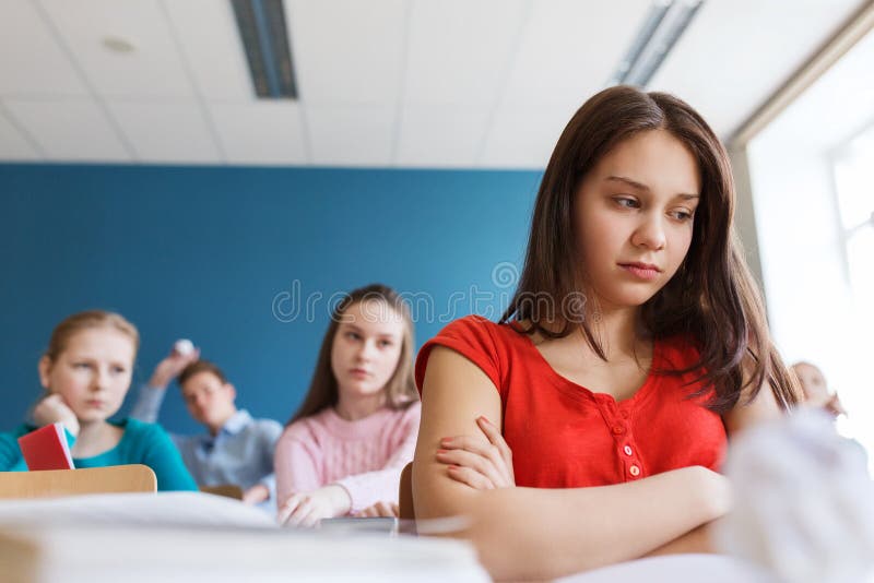 Students Gossiping Behind Classmate Back at School Stock Image - Image ...
