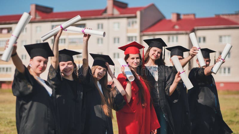 Students Graduate Holding Their Diplomas at the Top. Stock Photo ...