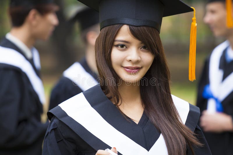 Students in Graduation Gowns on University Campus Stock Photo - Image ...