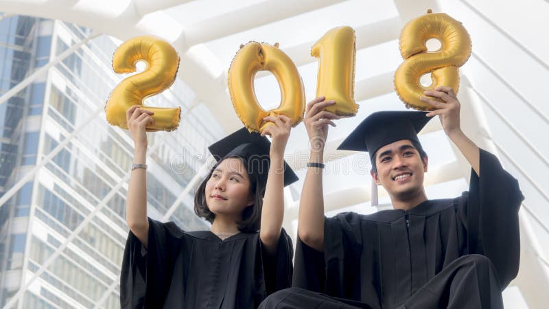Students in Graduation Suit Sit and Gold Number Balloons 2018 Stock ...