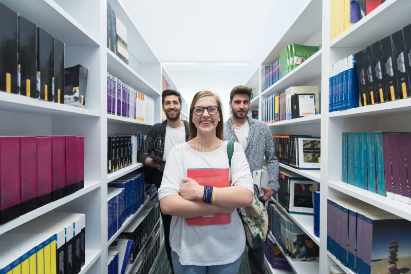 Students Group in School Library Stock Photo - Image of looking ...
