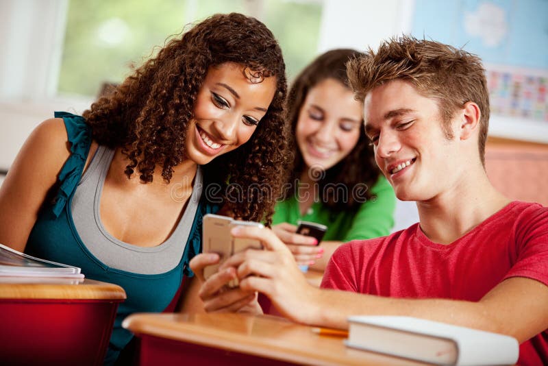 Students: Guy Shows Friend Text Message on Cell Phone Stock Photo ...